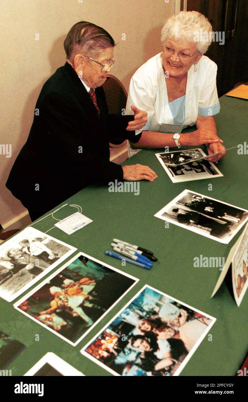 Karl Slover, left, and Donna Stewart-Hardway look over photos from the ...