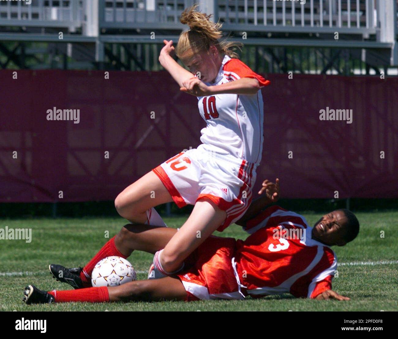 Canada's Claire Rustad (10) gets her leg twisted as she is tripped up ...
