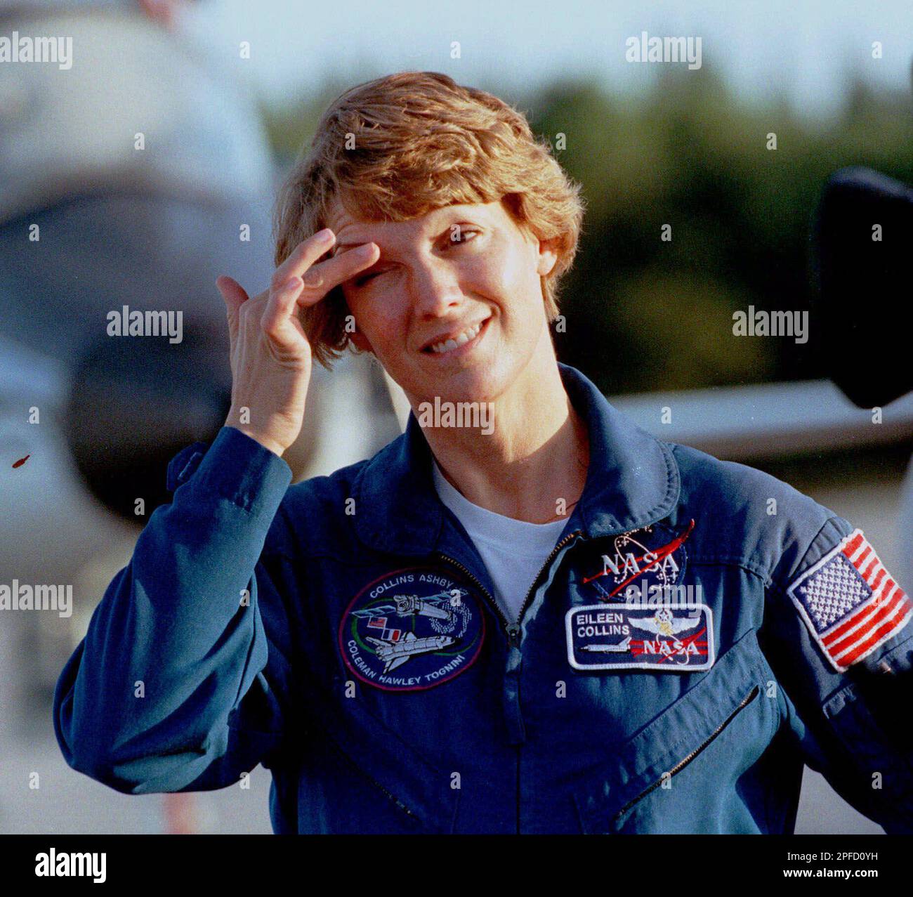Space shuttle Columbia commander Eileen Collins wipes her eye after ...