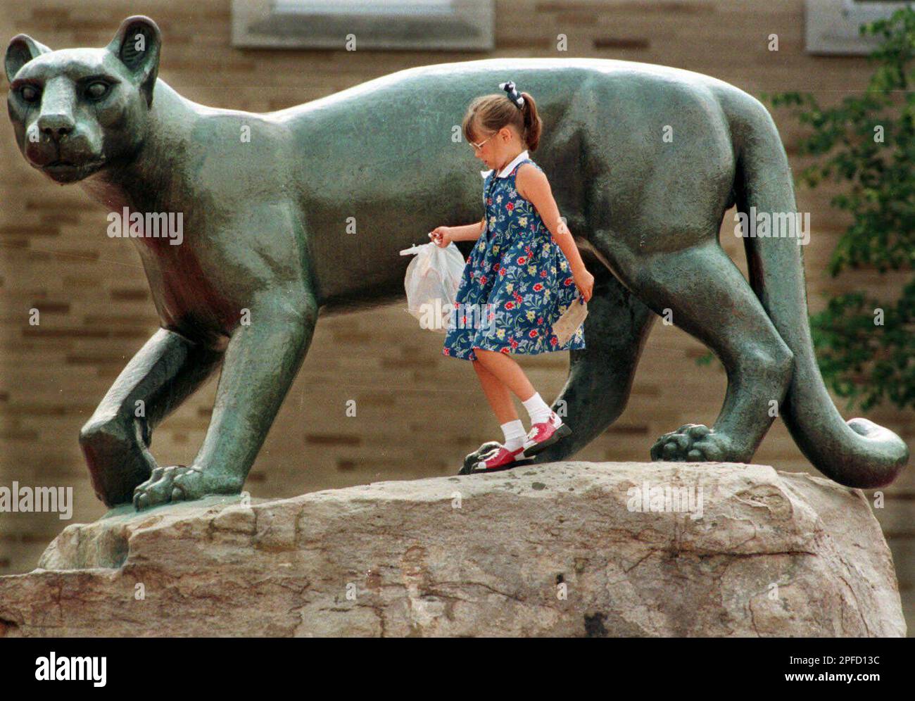 8-year-old Ashley Thompson of Altoona walks in front of the Altoona ...