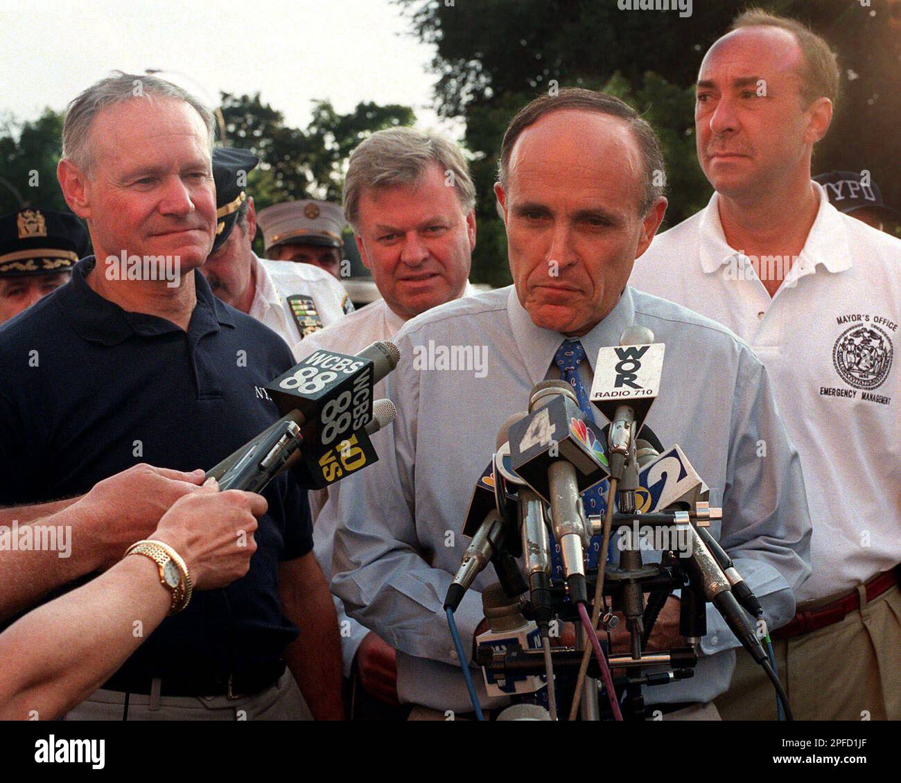 New York City Mayor Rudolph Giuliani, at microphone, discusses the ...
