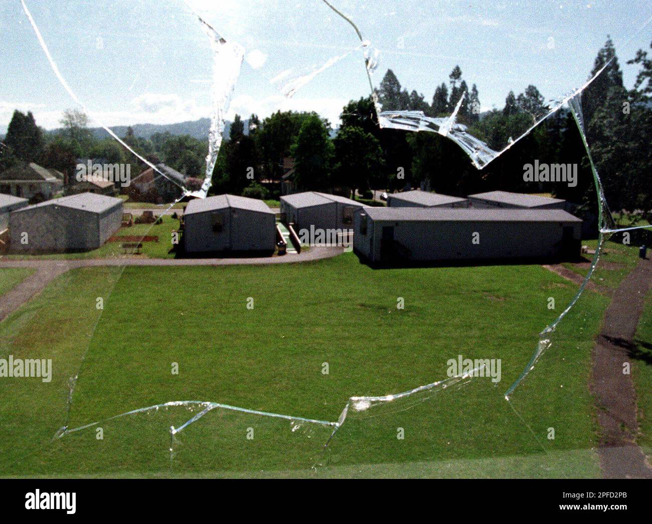 Modular buildings serving as classrooms are seen through a broken third ...
