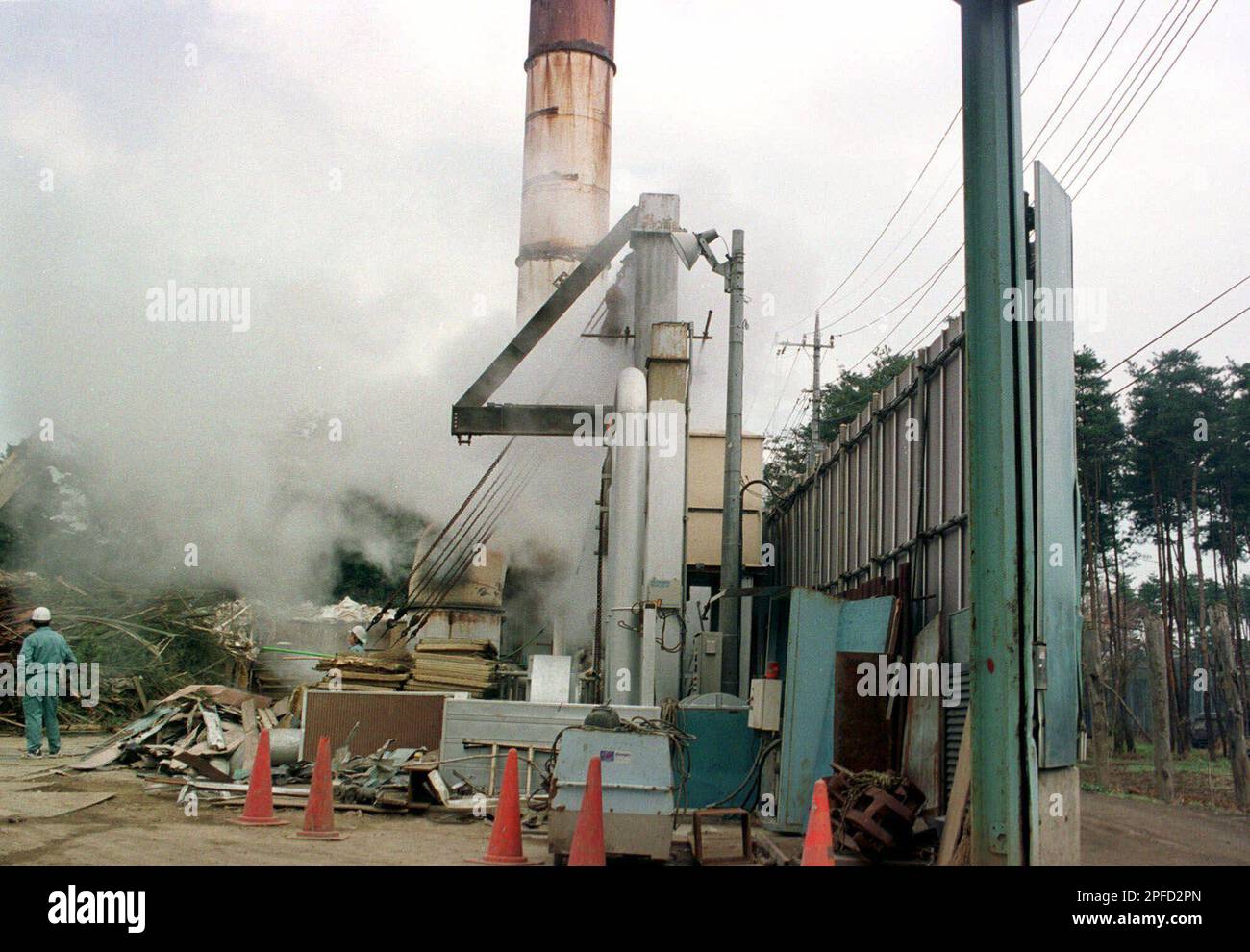 The air is filled with smoke from an incinerator at a waste processing ...