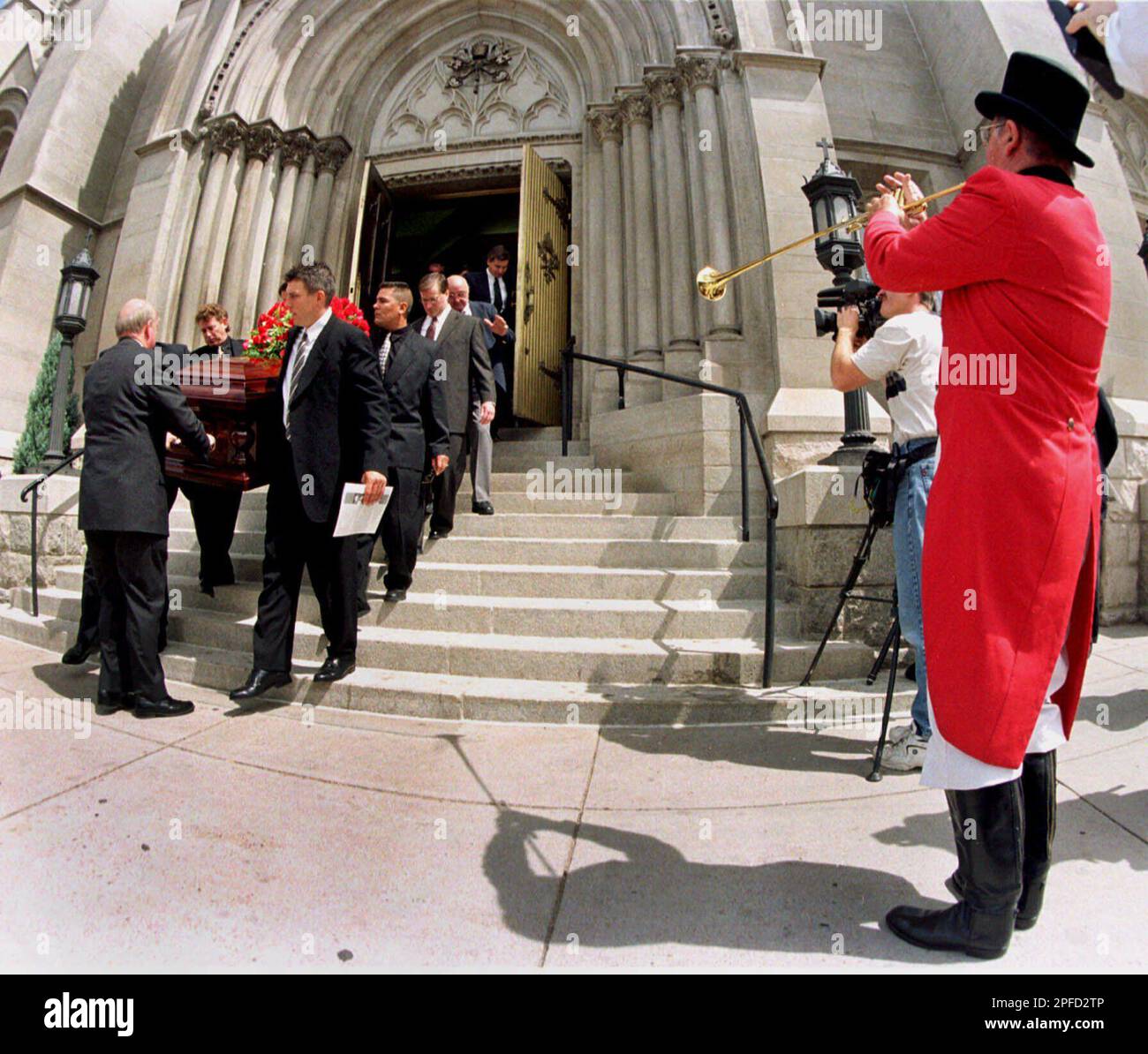 As pallbearers carry the casket bearing former Denver Nuggets trainer ...