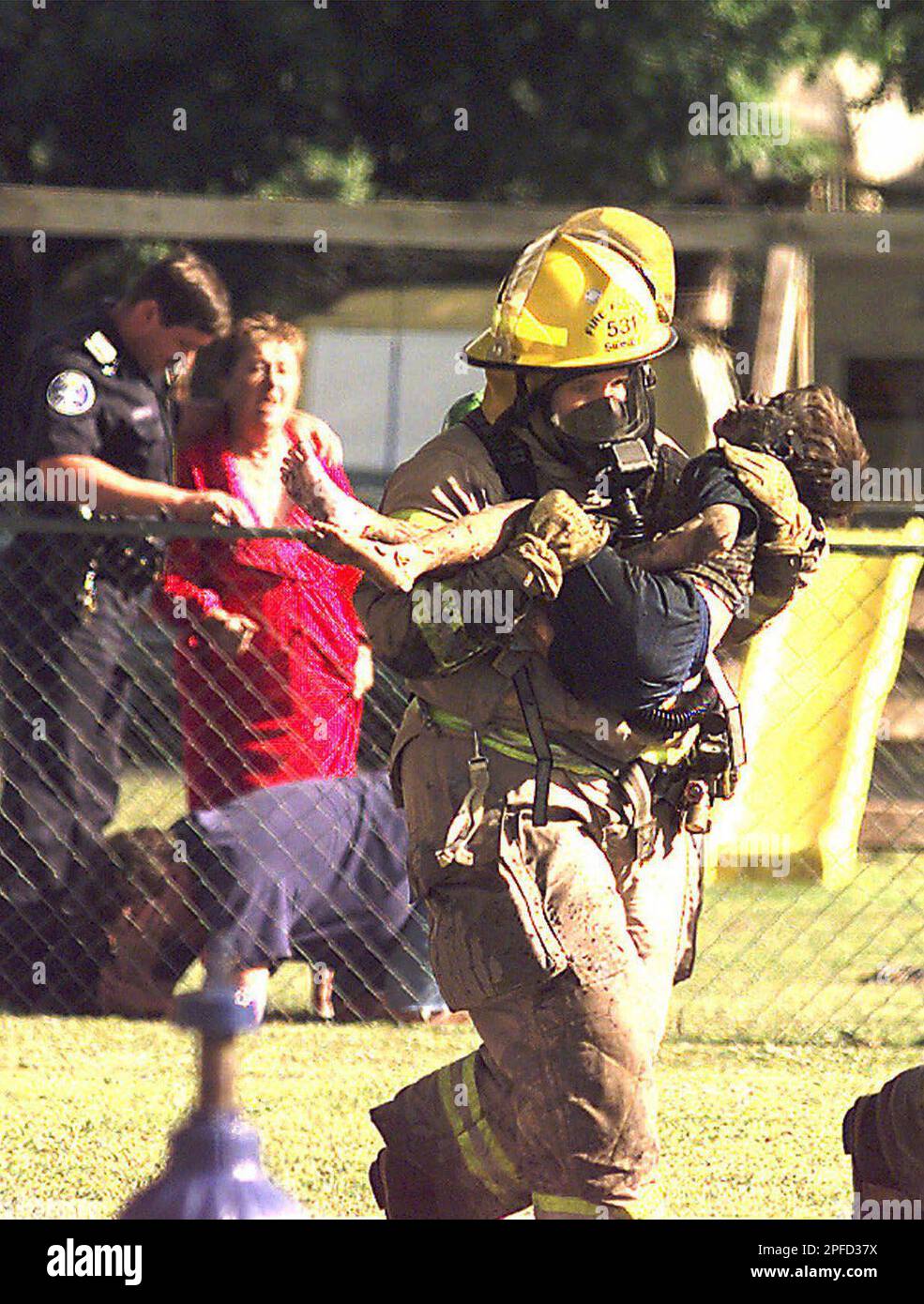 A Sidney, Ohio, fireman carries the body of 5-year-old Kevin "Luke ...