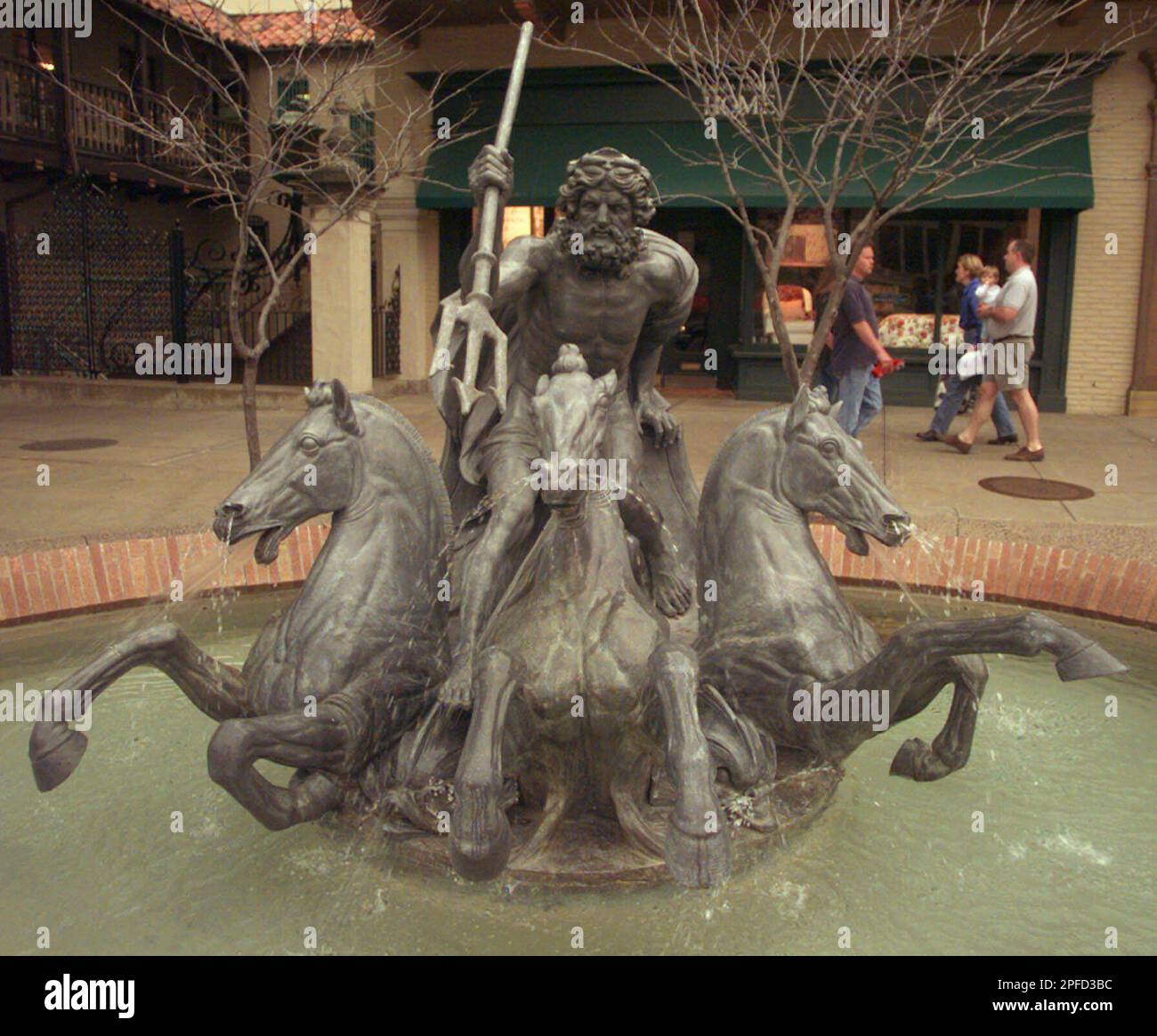Neptune guides his seahorse-drawn chariot in a fountain located on the ...
