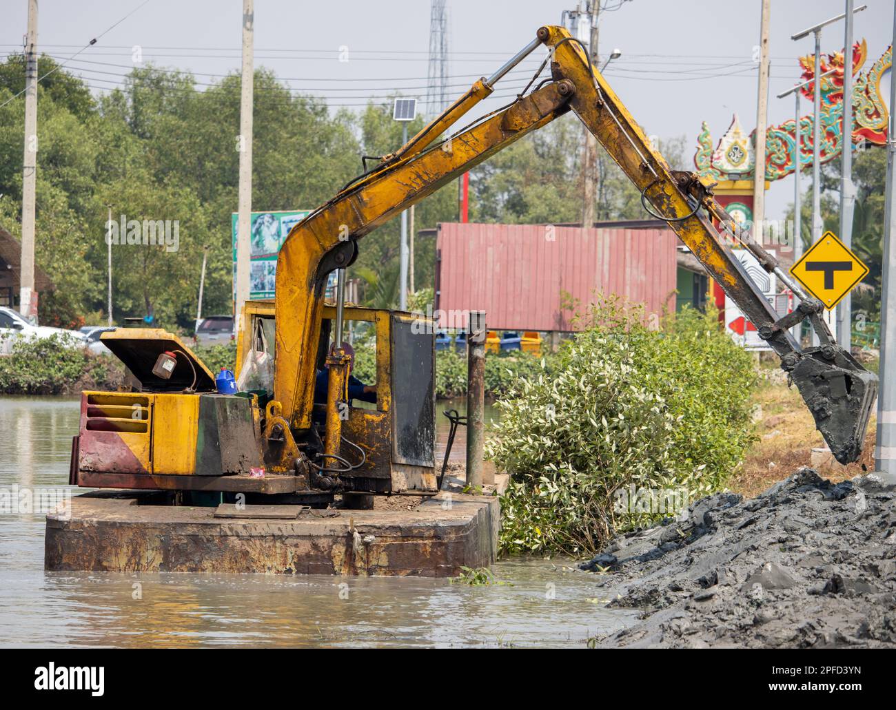 A floating dredger is dredging the bottom of the pond, Thailand Stock ...