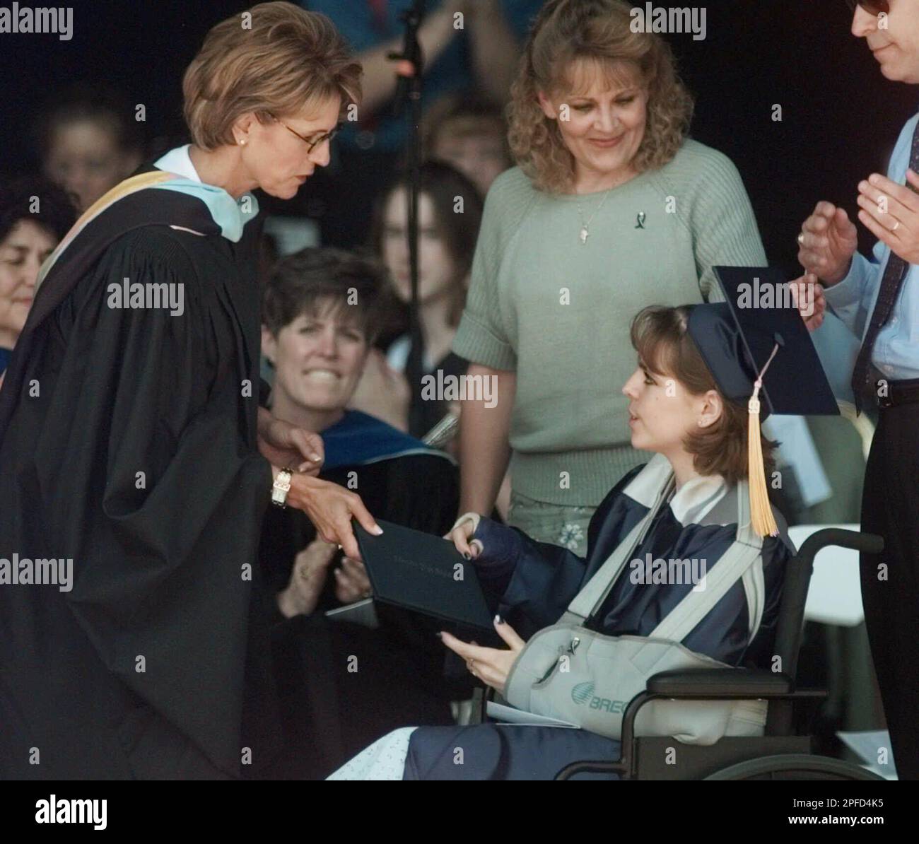 Columbine High School senior Lisa Kreutz, in wheelchair, is presented ...