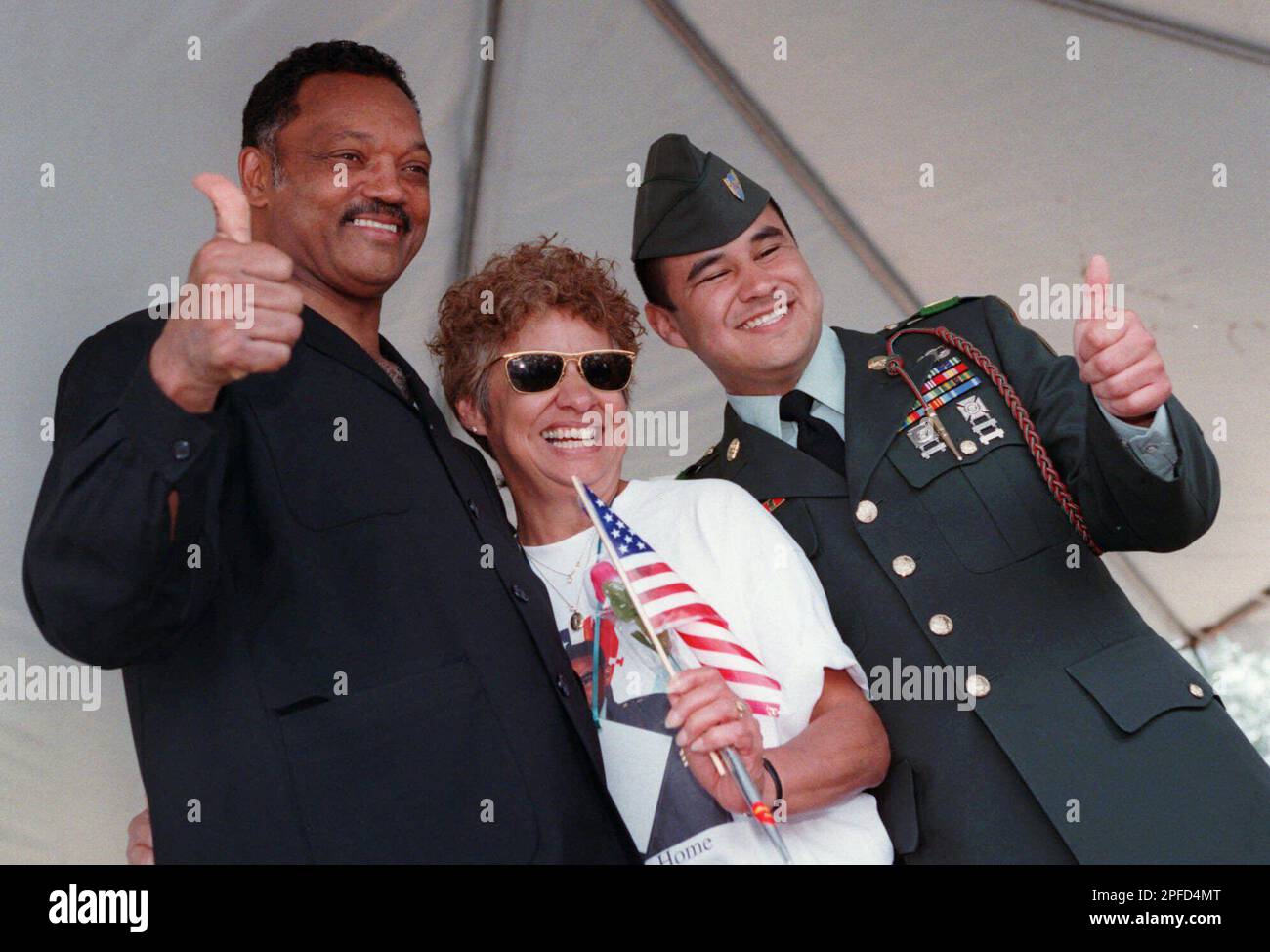 The Rev. Jesse Jackson, left, gives a thumbs up along with U.S Army ...