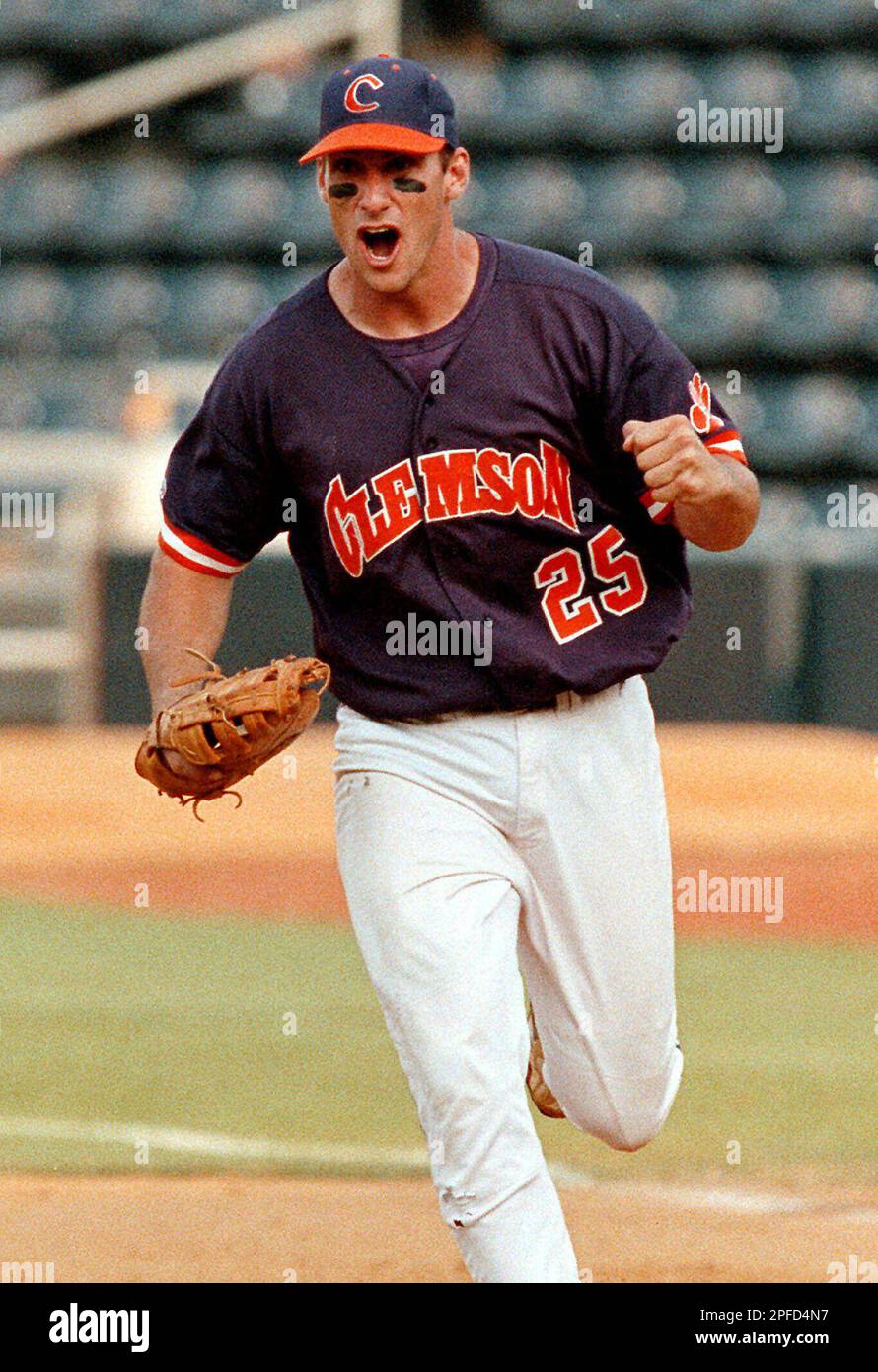 Clemson first baseman Jason Harris celebrates as he sprints off the ...