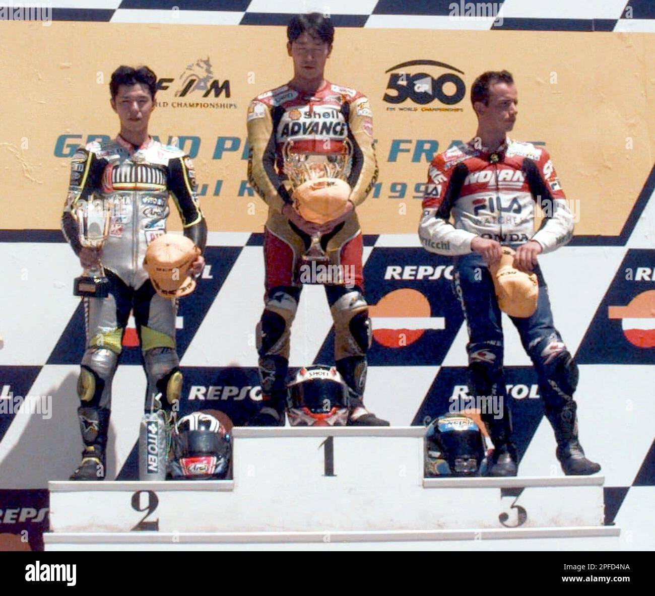 Japan's Tohru Ukawa, center, with compatriot Shinya Nakano, left, and ...