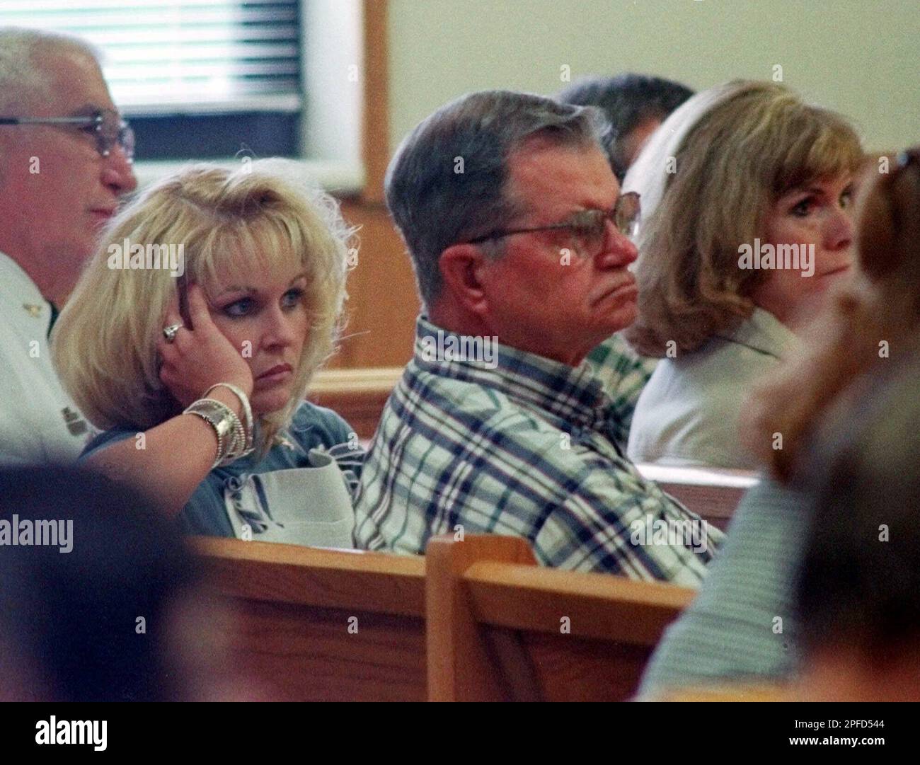 Brandy Turner, left, of Moody, Ala., sits with family members at the ...