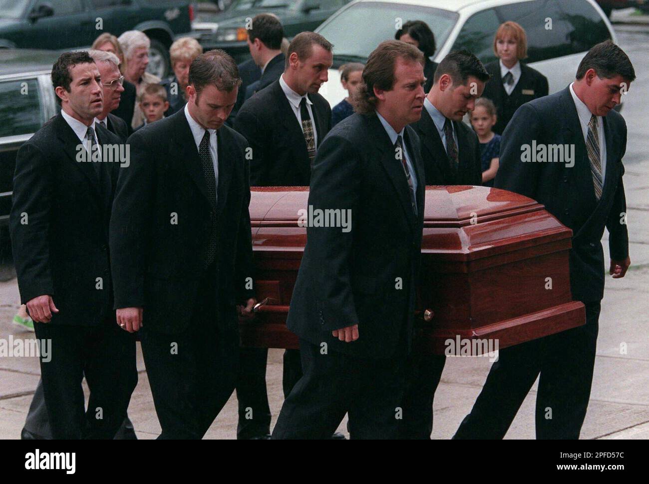 Pall bearers carry Carolina Hurricanes Steve Chiasson's coffin into the ...