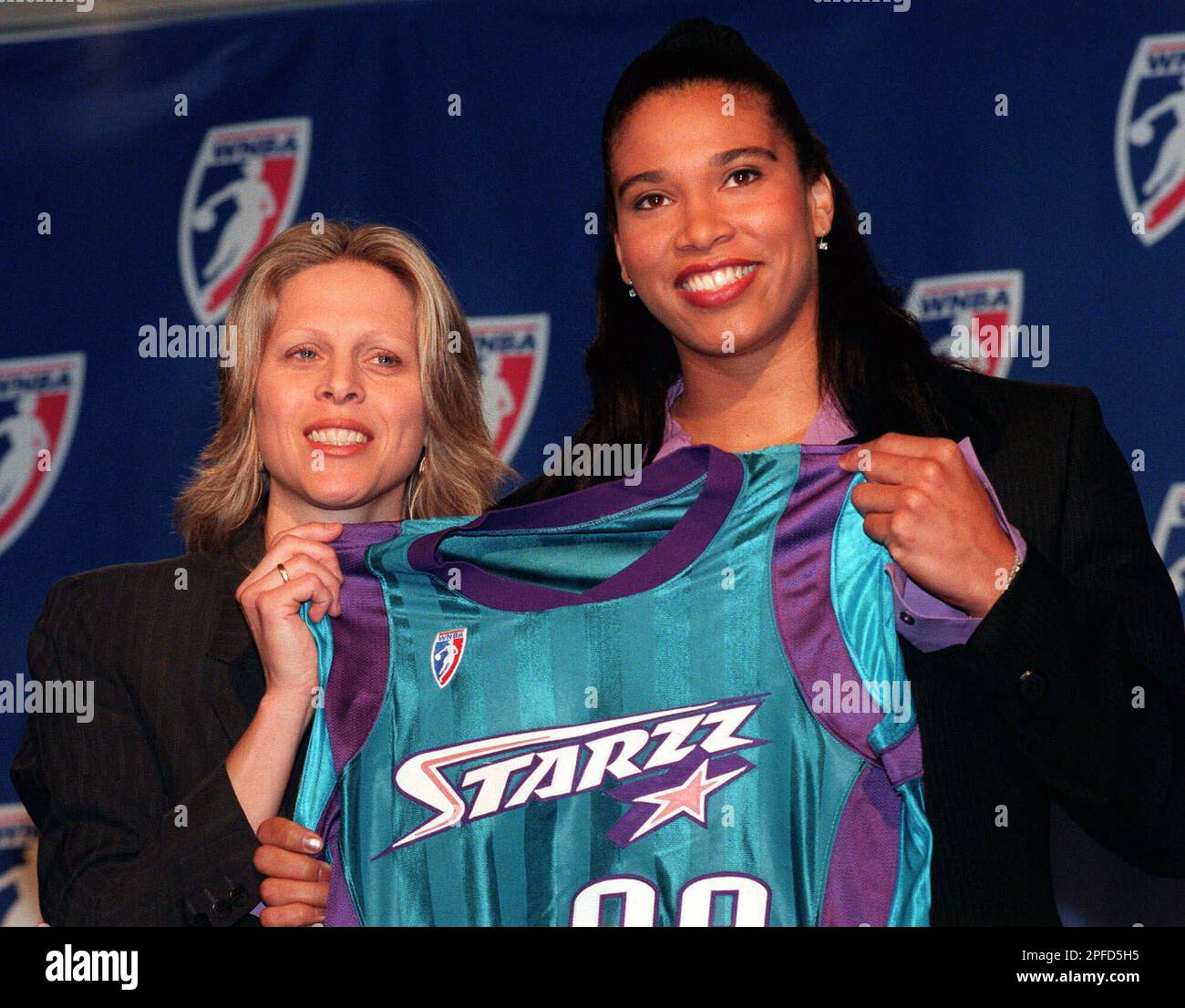 Natalie Williams, right, poses with WNBA President Valerie Ackerman ...