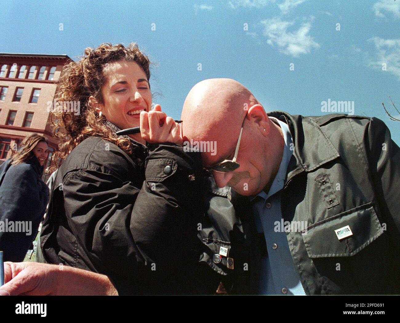 Melina Kanakaredes, left, autographs Roland Daigle's head Tuesday, April 13, 1999 in downtown ...