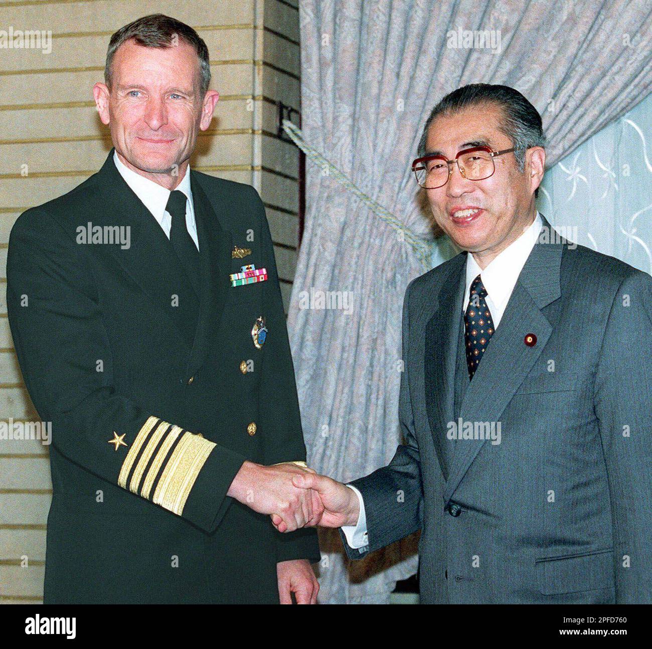 U.S. Pacific Command Commander Adm. Dennis Blair, left, is welcomed by ...