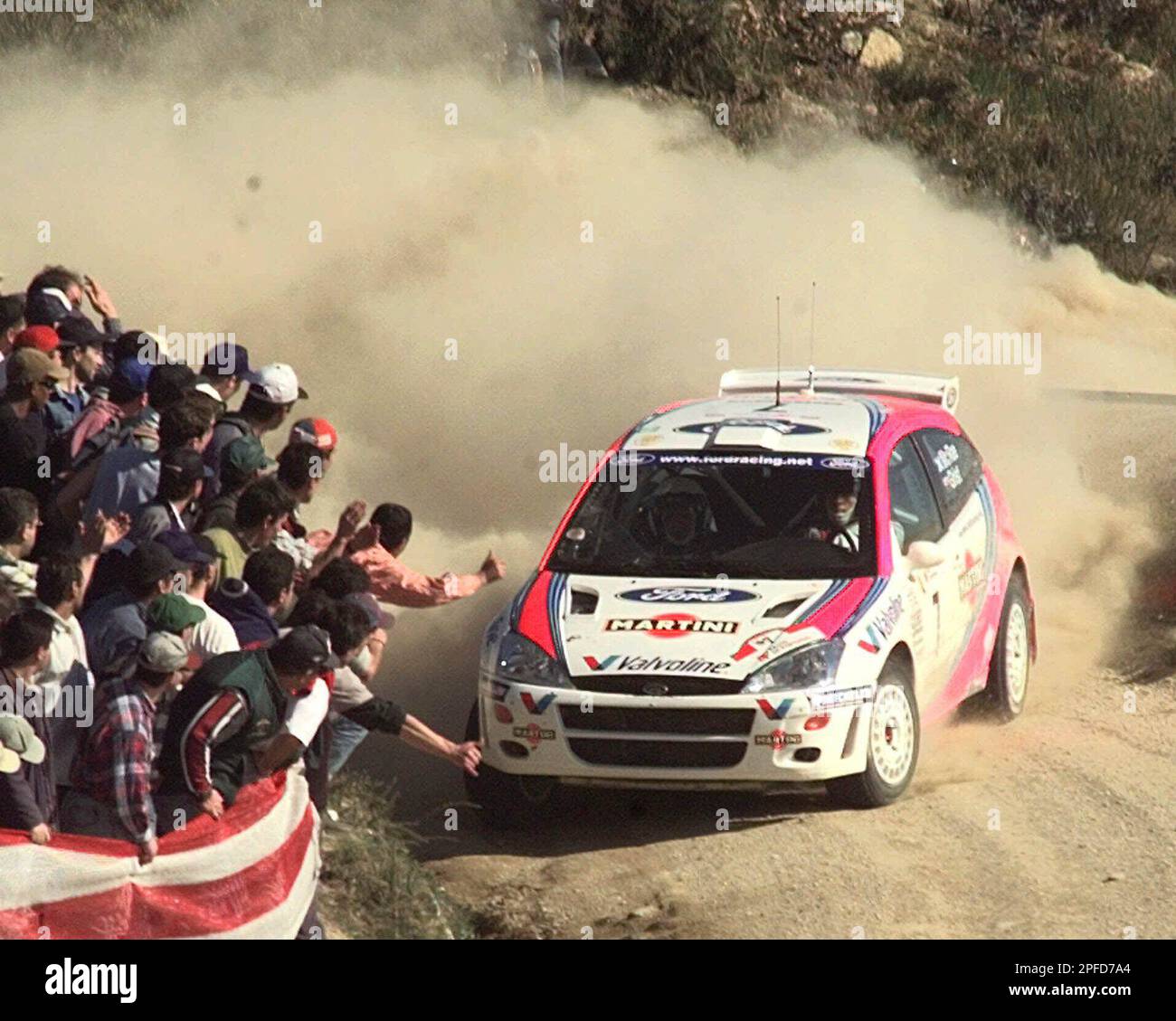 British driver Colin McRae steers his Ford Focus WRC down a mountain ...