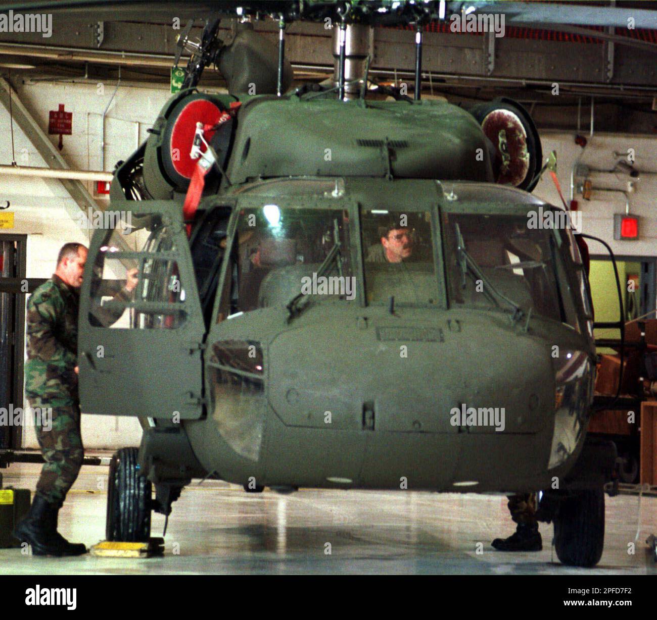 Vermont Army National Guard personnel check over the UH-60 Blackhawk ...