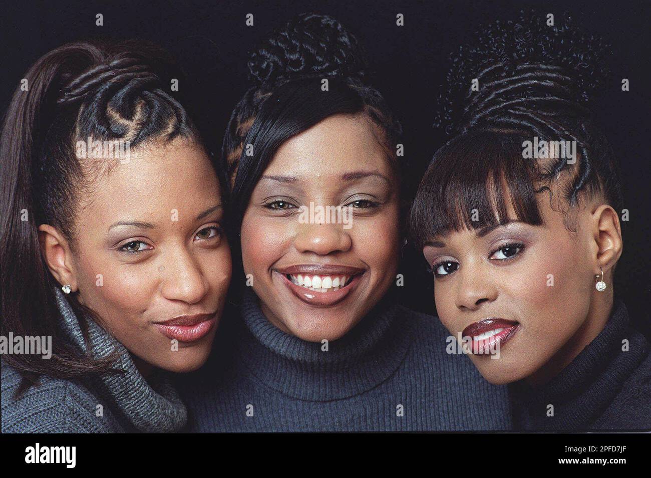 Members of the singing group Divine pose following an interview in New ...