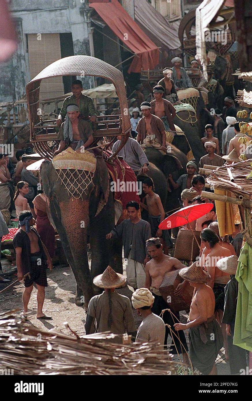 Elephants parade through the bazaar during filming of "Anna and The ...