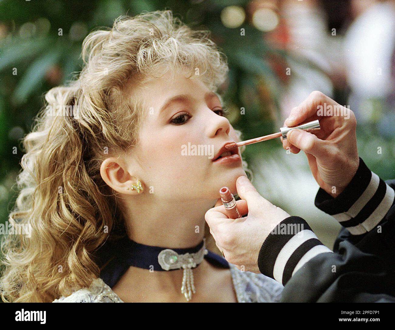 Amanda Garver, 9, of York, Pa., has lipstick applied before she ...