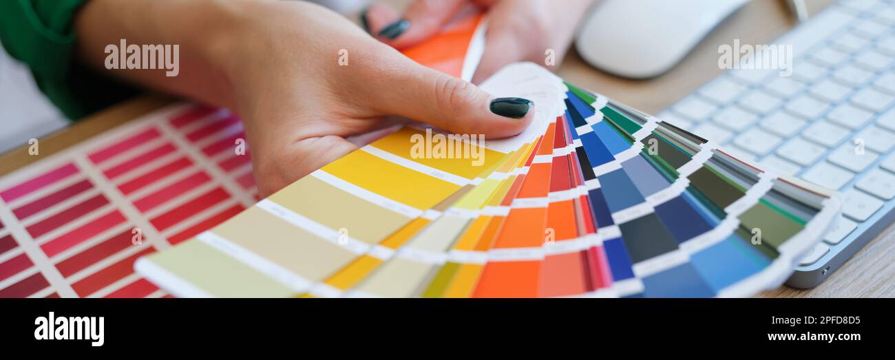 Graphic designer is working on choosing palette colors for creative ...