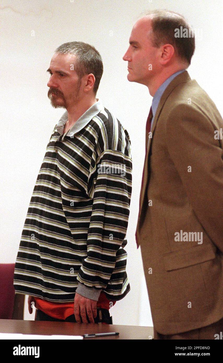 Former fugitive Alis Ben Johns, left, listens with his lawyer Chris ...