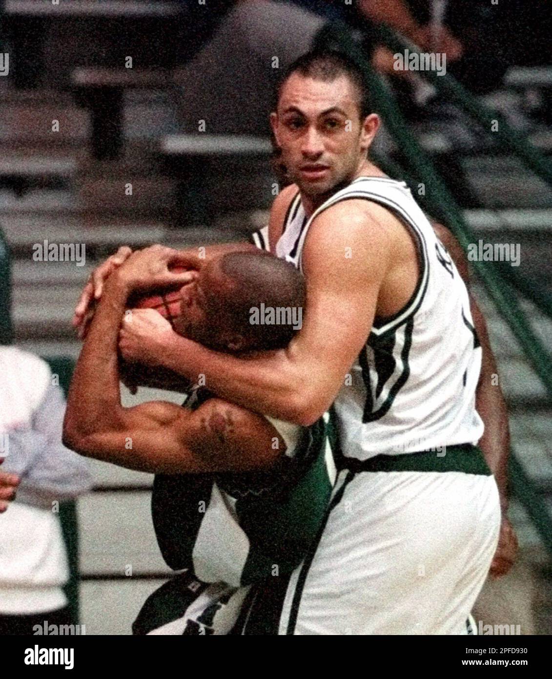 Tulane's Ted Kritza, right, wraps up North Carolina-Charlotte's Marlon ...