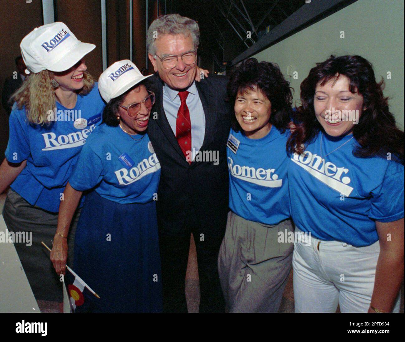 Colorado Governor Roy Romer, third from left, is surrounded by ...