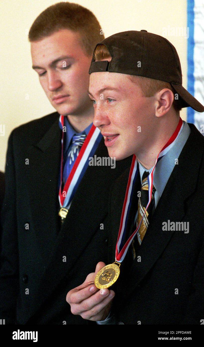 Josh Ryker, right, shows off the medal he received from First Alert at ...