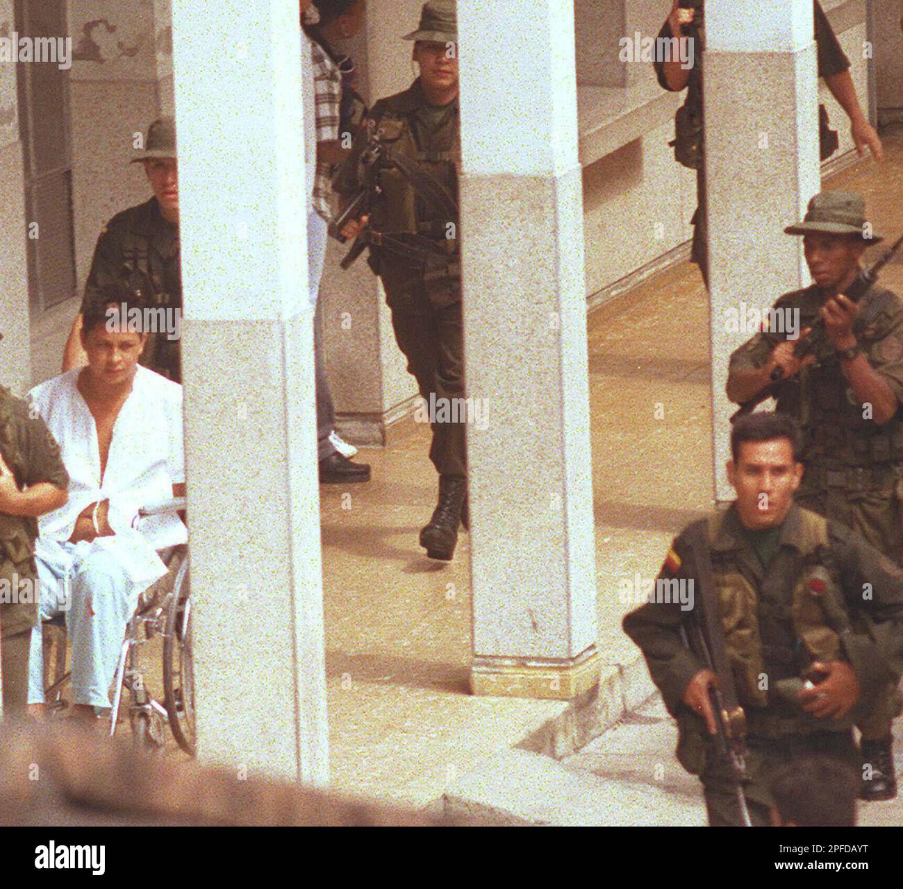 Rafael Angel Uribe Serna, (on wheel chair), 32, assassin of the former ...