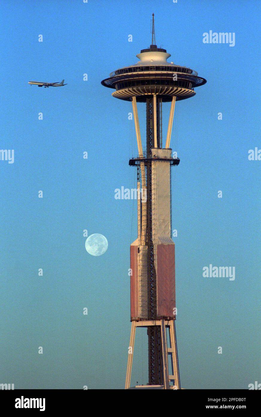 A full moon sets off two of Seattle landmarks, the Space Needle and a ...