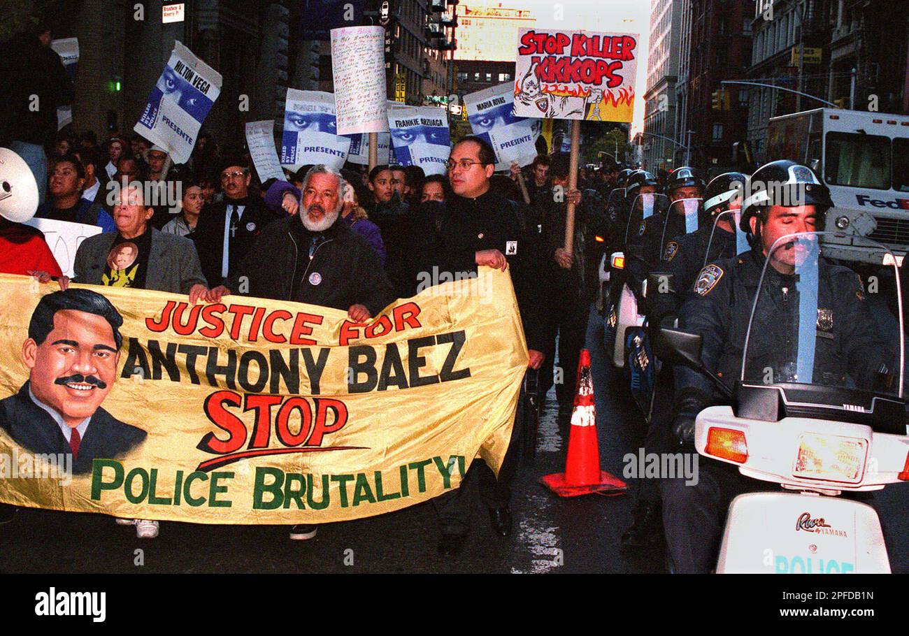 Iris, left, and Ramon Baez, second from left, the parents of Anthony ...