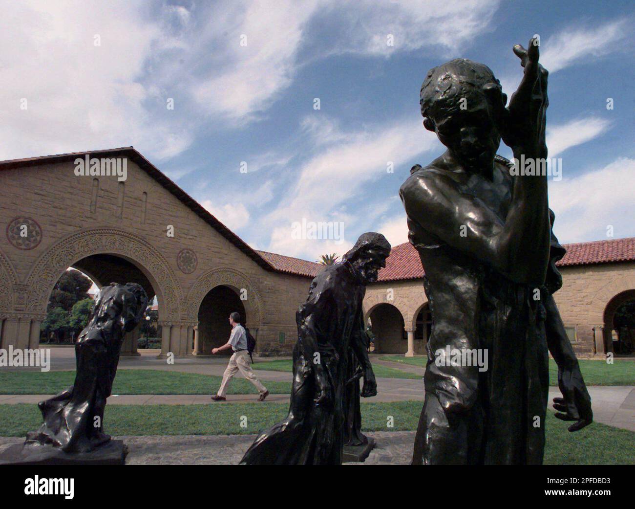 A Stanford University student walks through a Rodin statue garden on ...