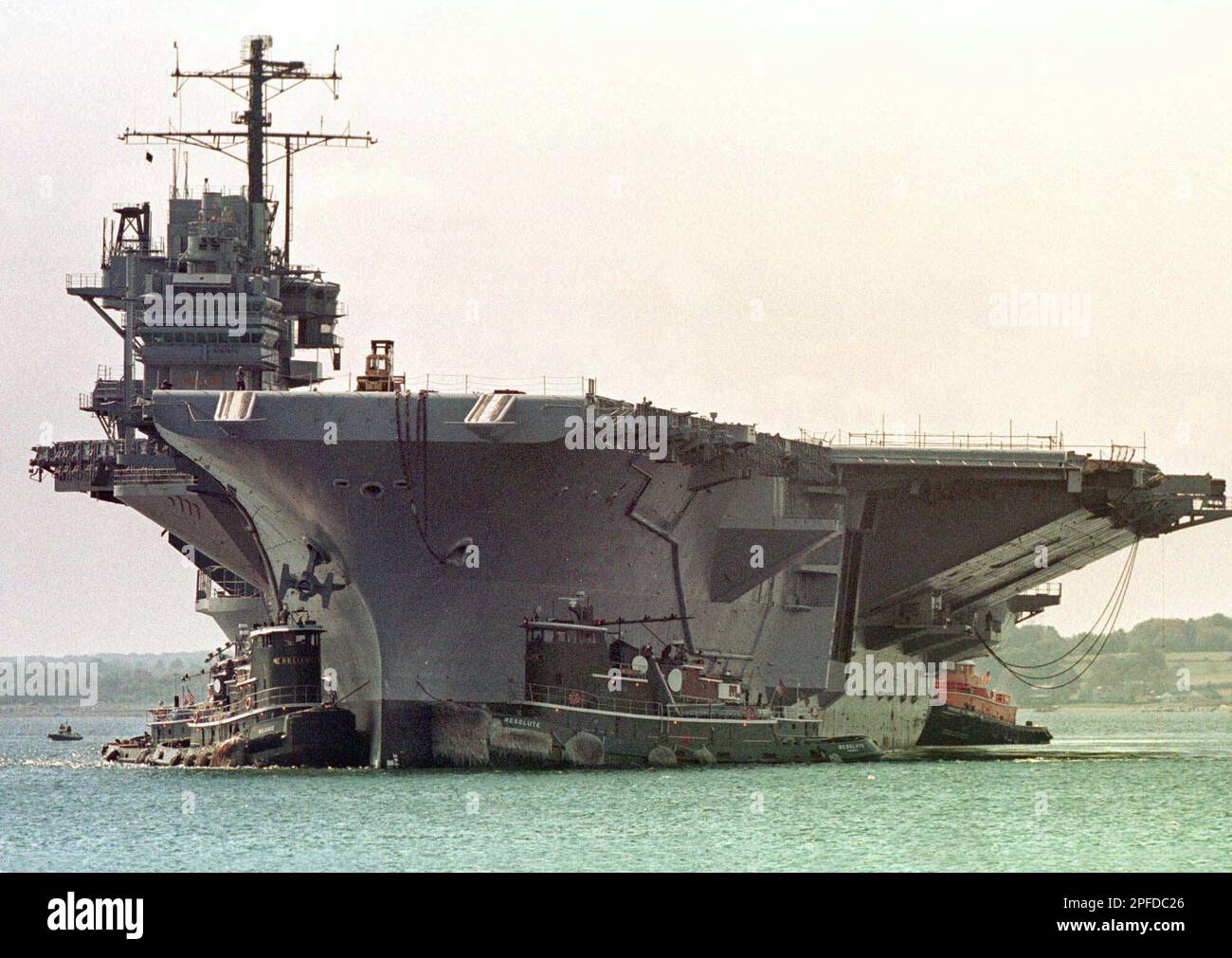 The USS Forrestal is guided into Coddington Cove Friday, Sept. 18, 1998 ...