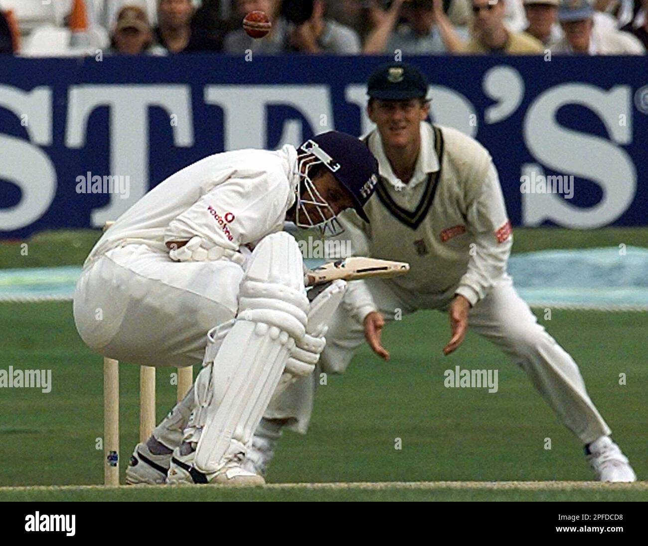England's Mark Butcher avoids a bouncer from South Africa's Allan ...