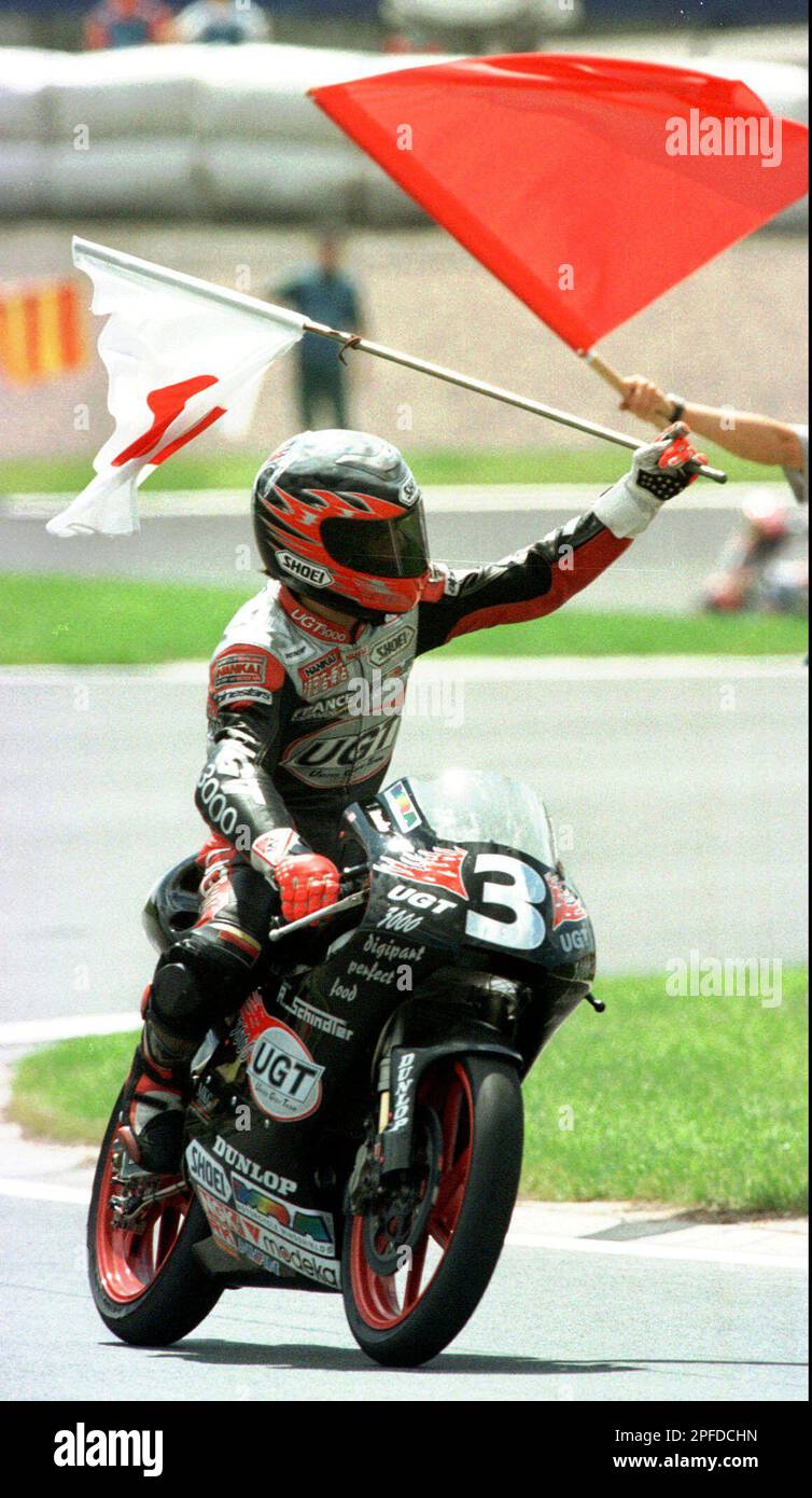 Japanese Tomomi Manako celebrates his victory after winning the 125cc ...