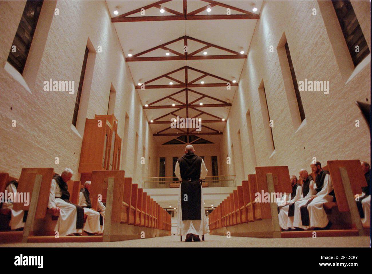 Trappist monks observe their first group prayer of the day called ...