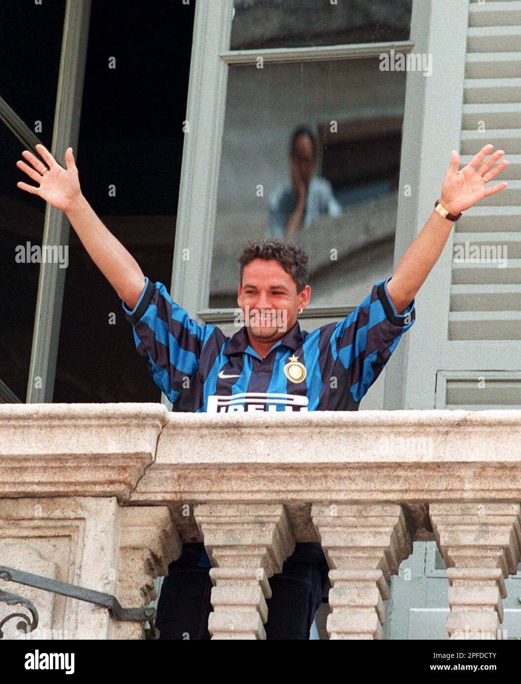 Italian soccer ace Roberto Baggio waves to fans as he wears the jersey ...