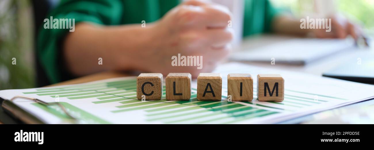 Claim text on cubes on business charts and angry business people Stock ...