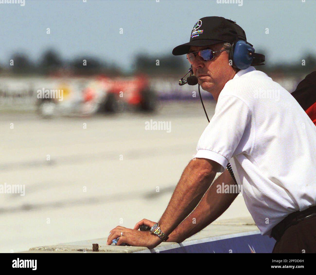 Rick Mears watches the Team Pensk cars during provisional qualifying ...