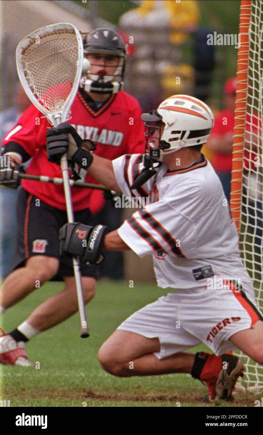 Princeton University goalie Corey Popham deflects a shot on goal as ...