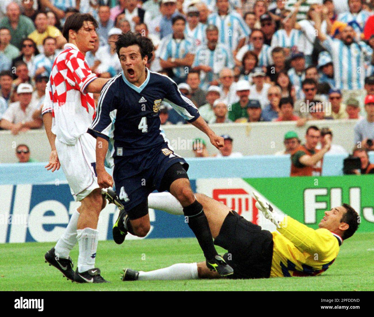 Argentina's Hector Pineda, center, celebrates after he scores against ...