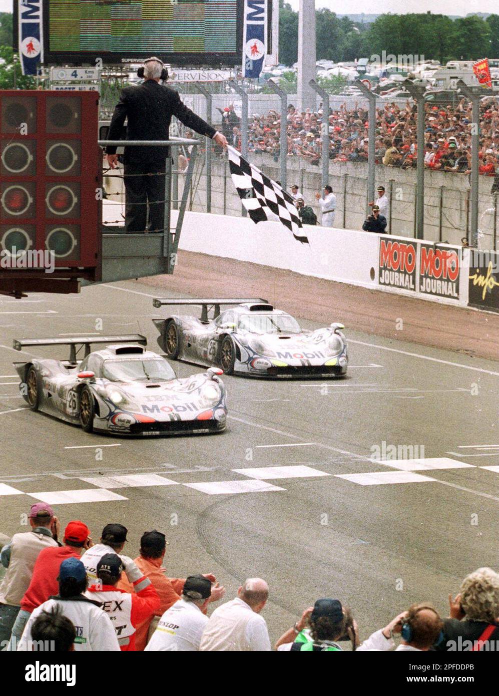 The Porsche driven by Britain's Alan McNish, France's Stephane Ortelli ...