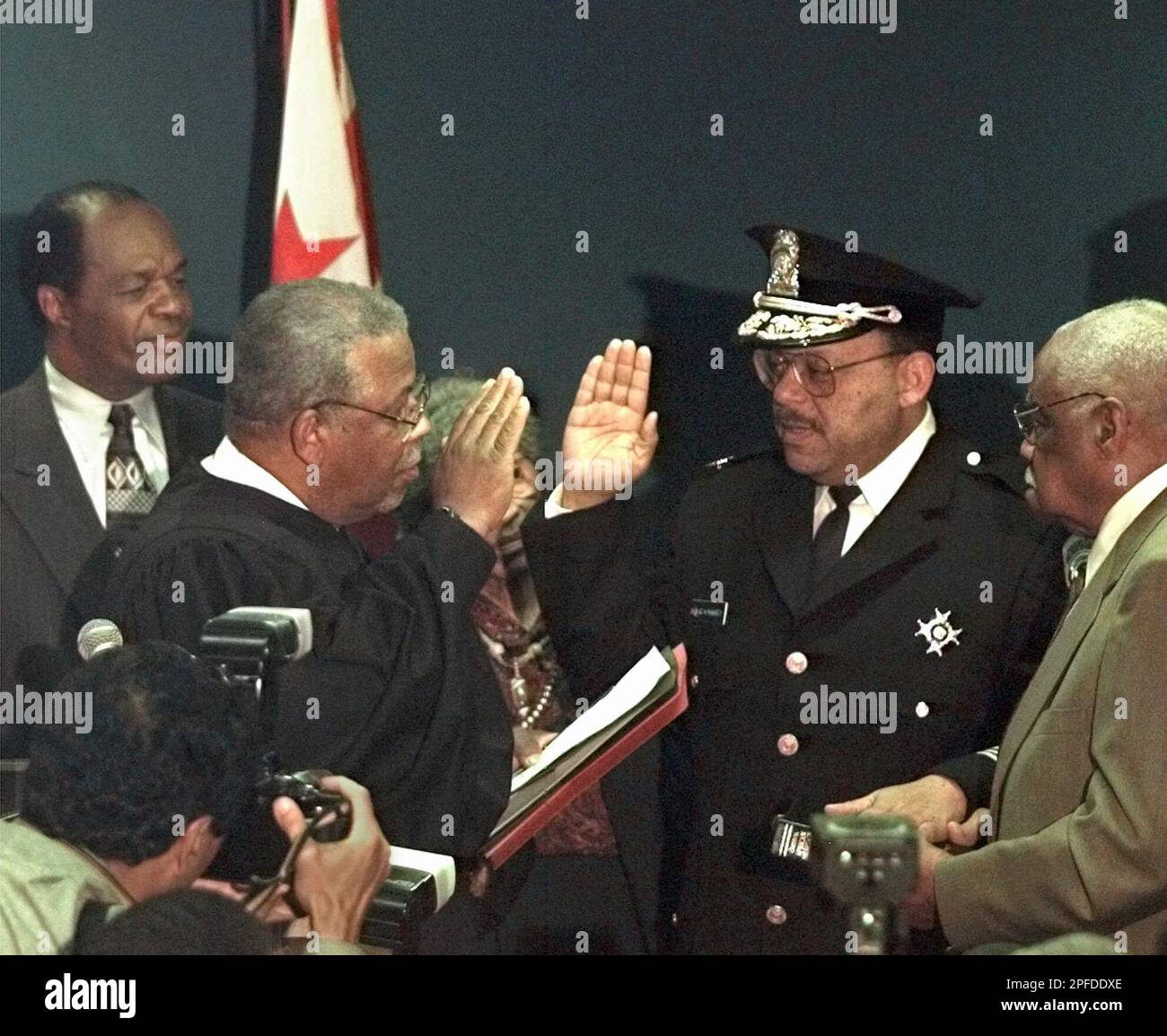 Superior Court Judge Eugene Hamilton adminsters the oath of office to ...
