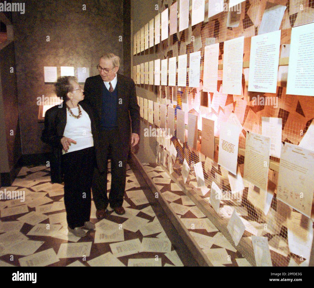 Lisa Fittko and Walter Meyerhof look at a display of historical ...