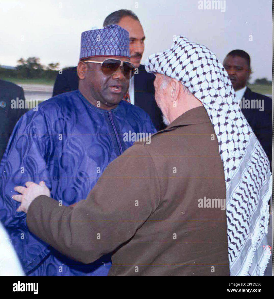 Nigerian ruler Gen. Sani Abacha greets PLO leader Yasser Arafat, right ...