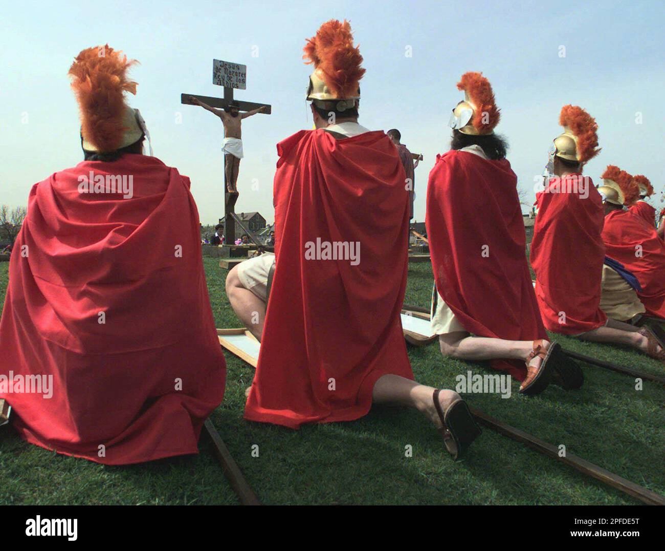 Roman soldiers wait and watch as Raul Centeno, center, portraying Jesus ...