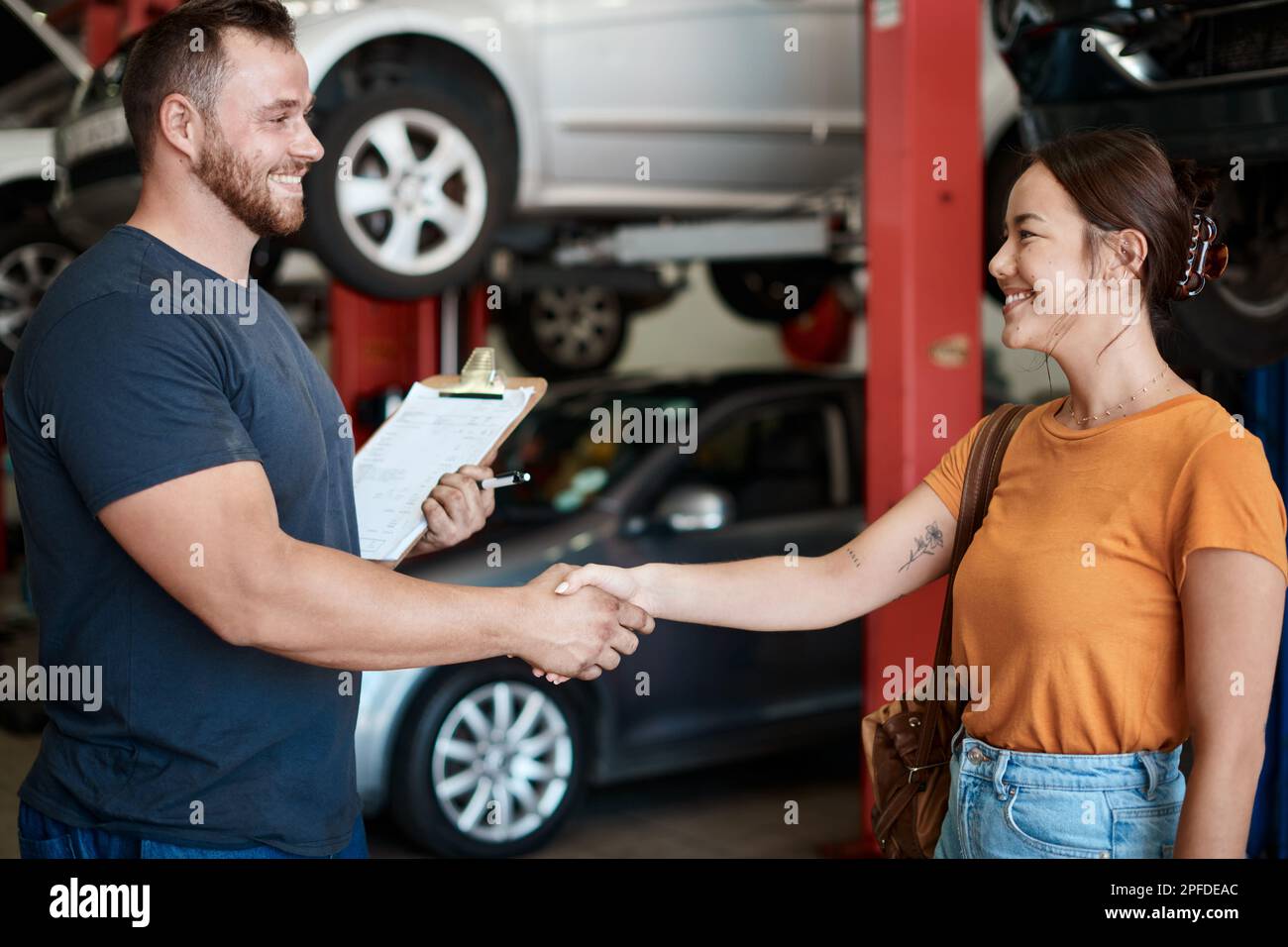 Woman shaking hands mechanic hi-res stock photography and images - Alamy