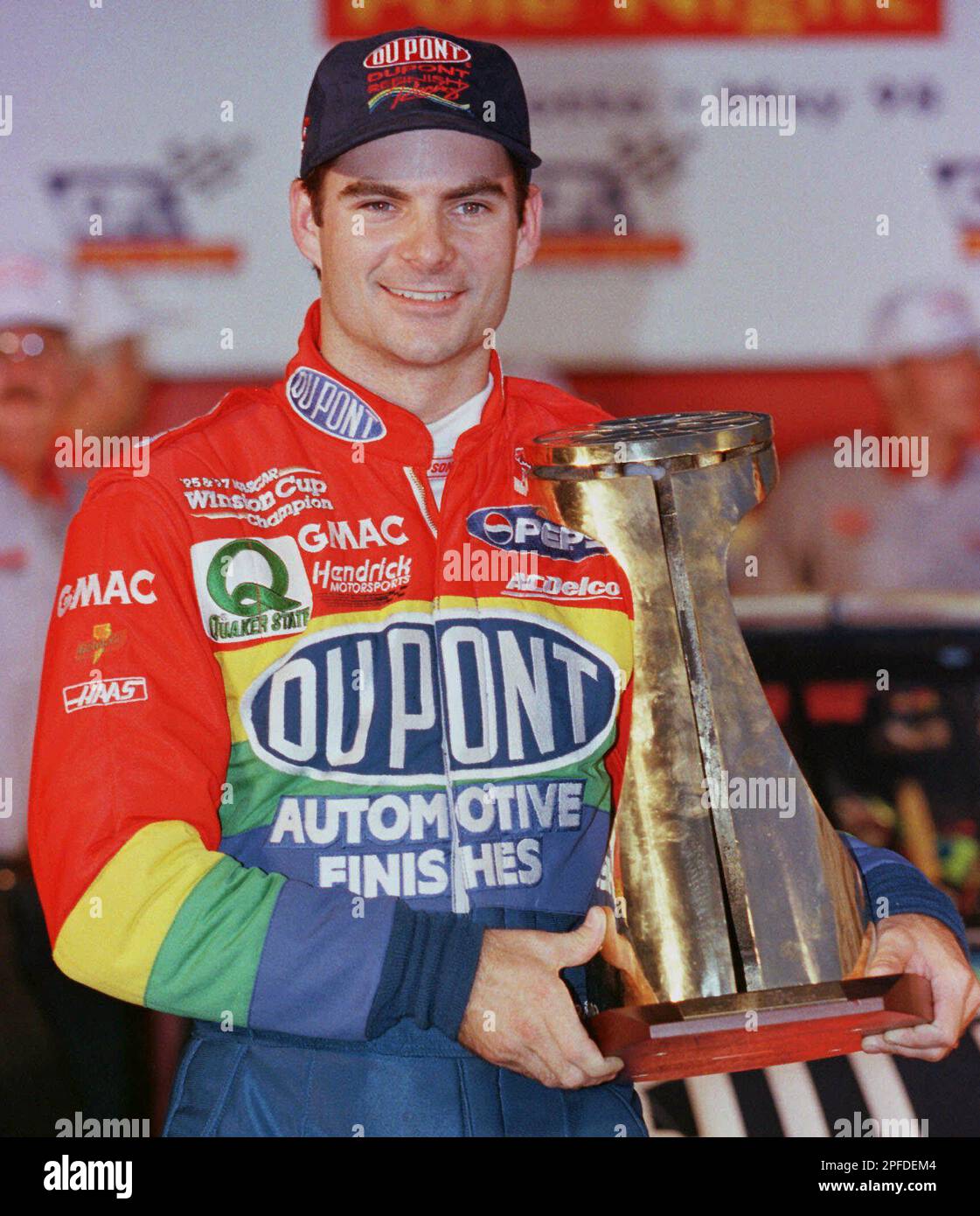 Jeff Gordon of Pittsboro, Ind., holds the trophy in victory lane at the ...